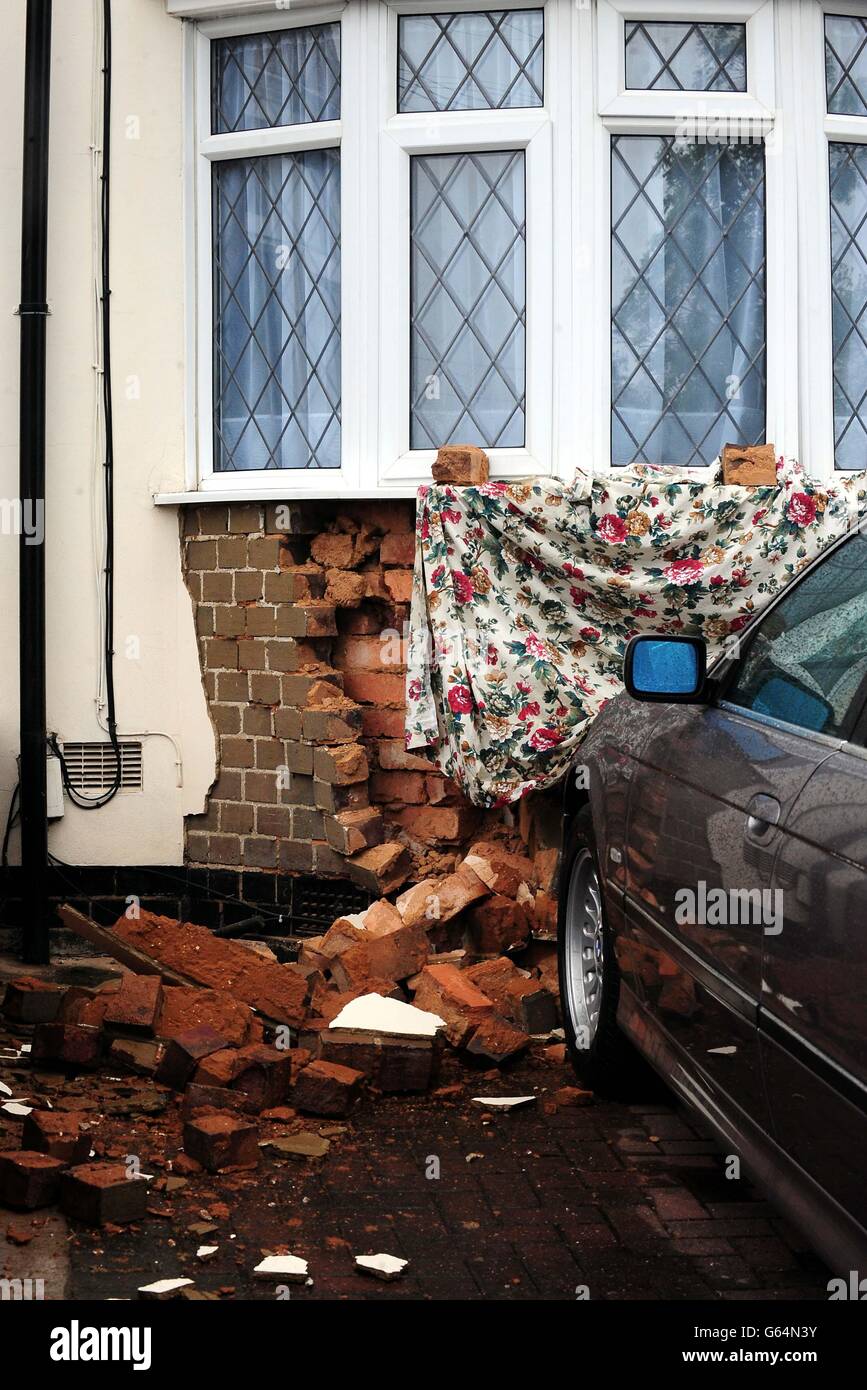 Car through house wall hi-res stock photography and images - Alamy