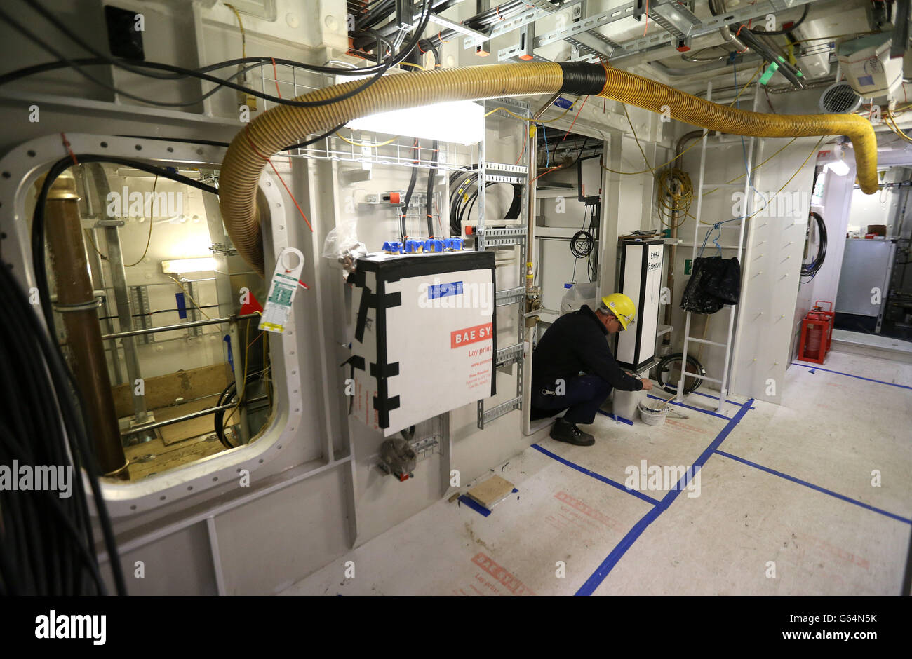 Work continues in a passageway during a look at work on the Aft Island ...