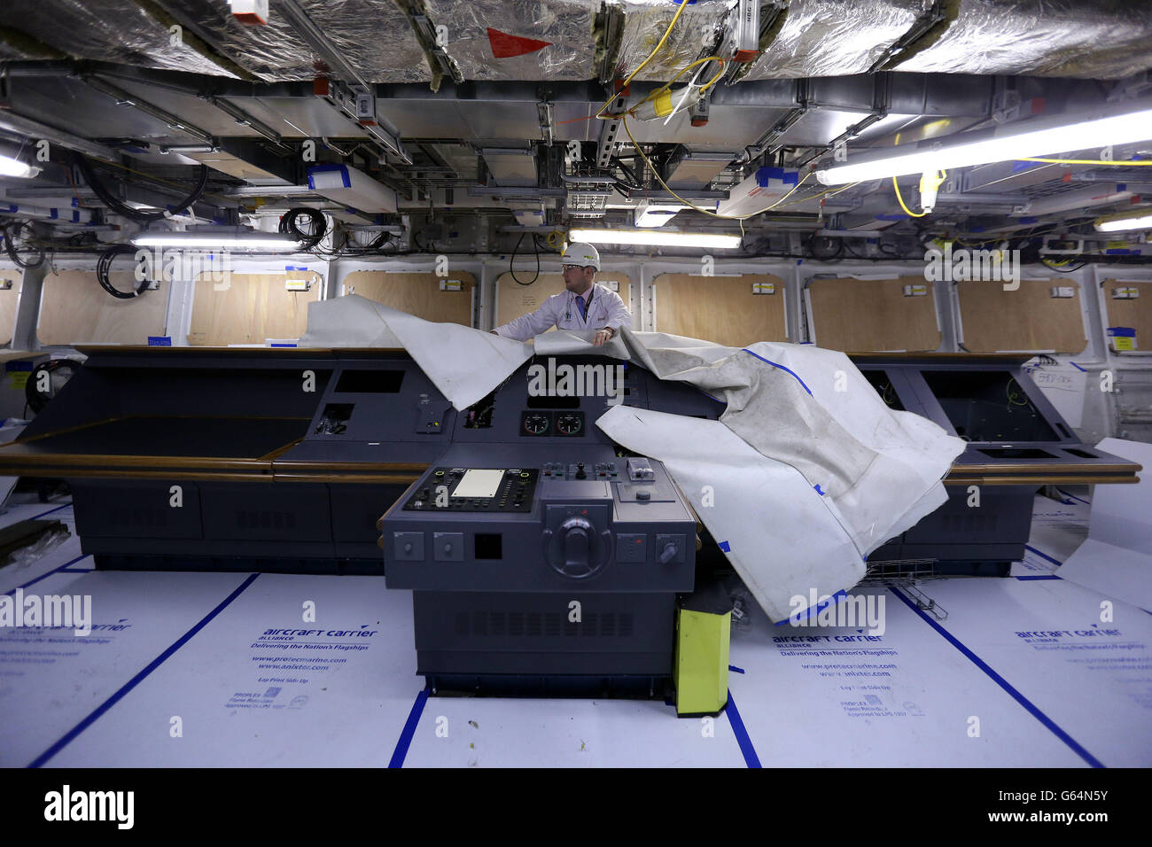 BAE Systems Mark Hughes removes covers to show the interiors of the ...