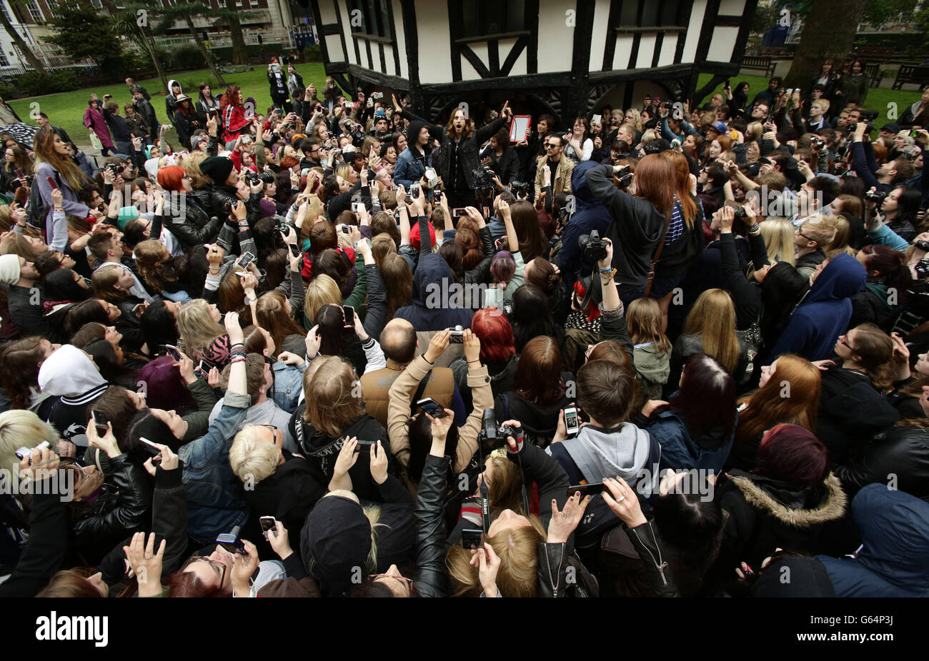 Jared Leto (centre back) of 30 Seconds to Mars performing a 'flash gig ...