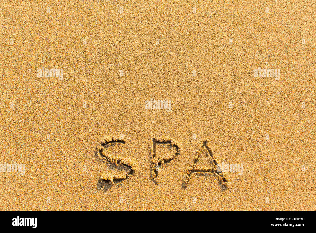 Spa - word drawn on the sand beach Stock Photo - Alamy