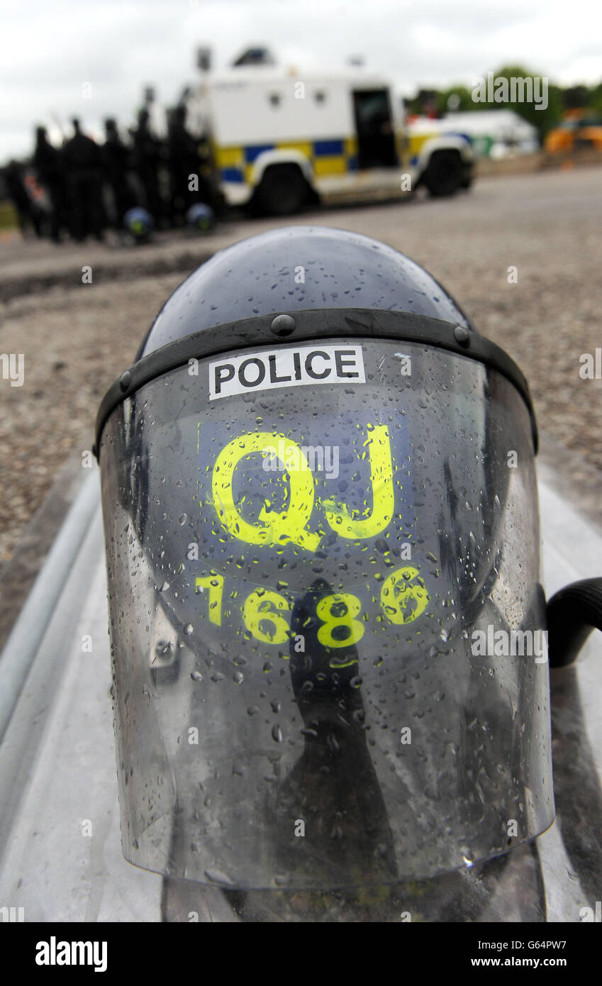 Embargoed to 0001 monday june police riot helmet on shield hi-res stock ...