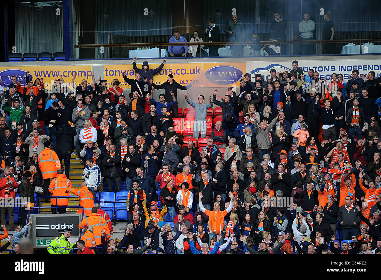 Blackpool fans set off a flare in the stands hi-res stock photography ...
