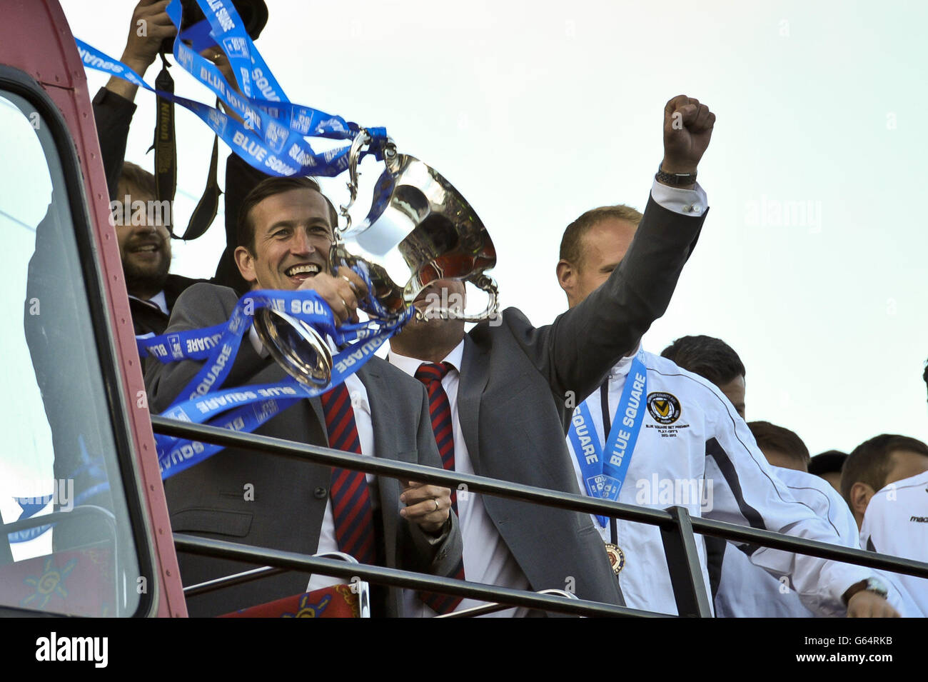 Newport County AFC manager Justin Edinburgh lifts the trophy as his ...