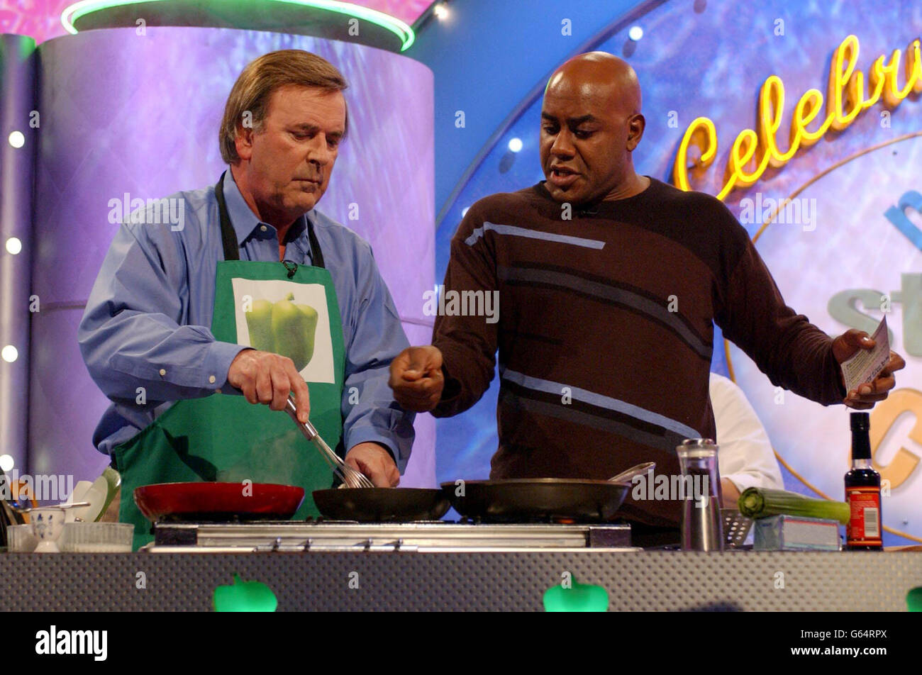 TV chef Ainsley Harriott (right) talks to guest Terry Wogan during a ...
