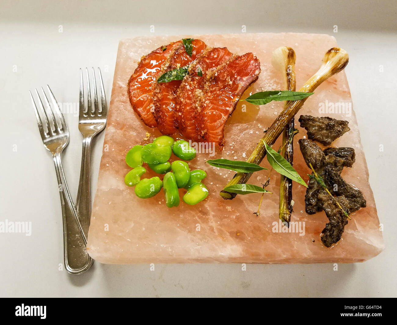 Glistening salmon sashimi with butter poached morel mushrooms, salt ...
