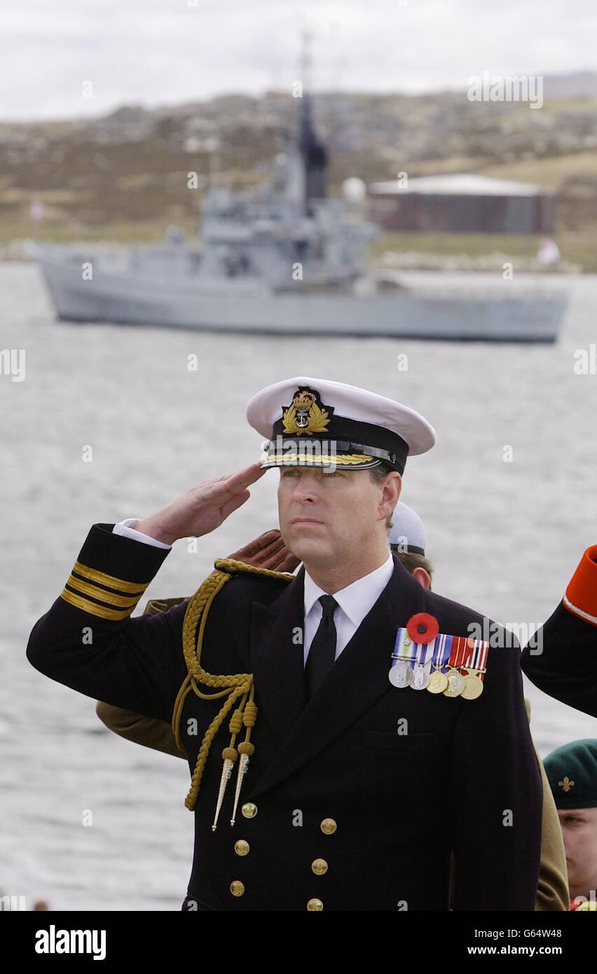 The Duke of York with HMS Leeds Castle behind him, salutes the Cross of ...