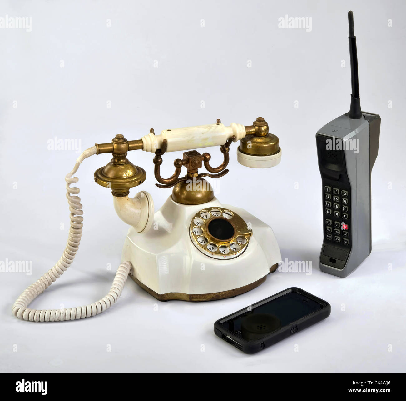 Working smart cell phone and old white rotary telephone Stock Photo - Alamy