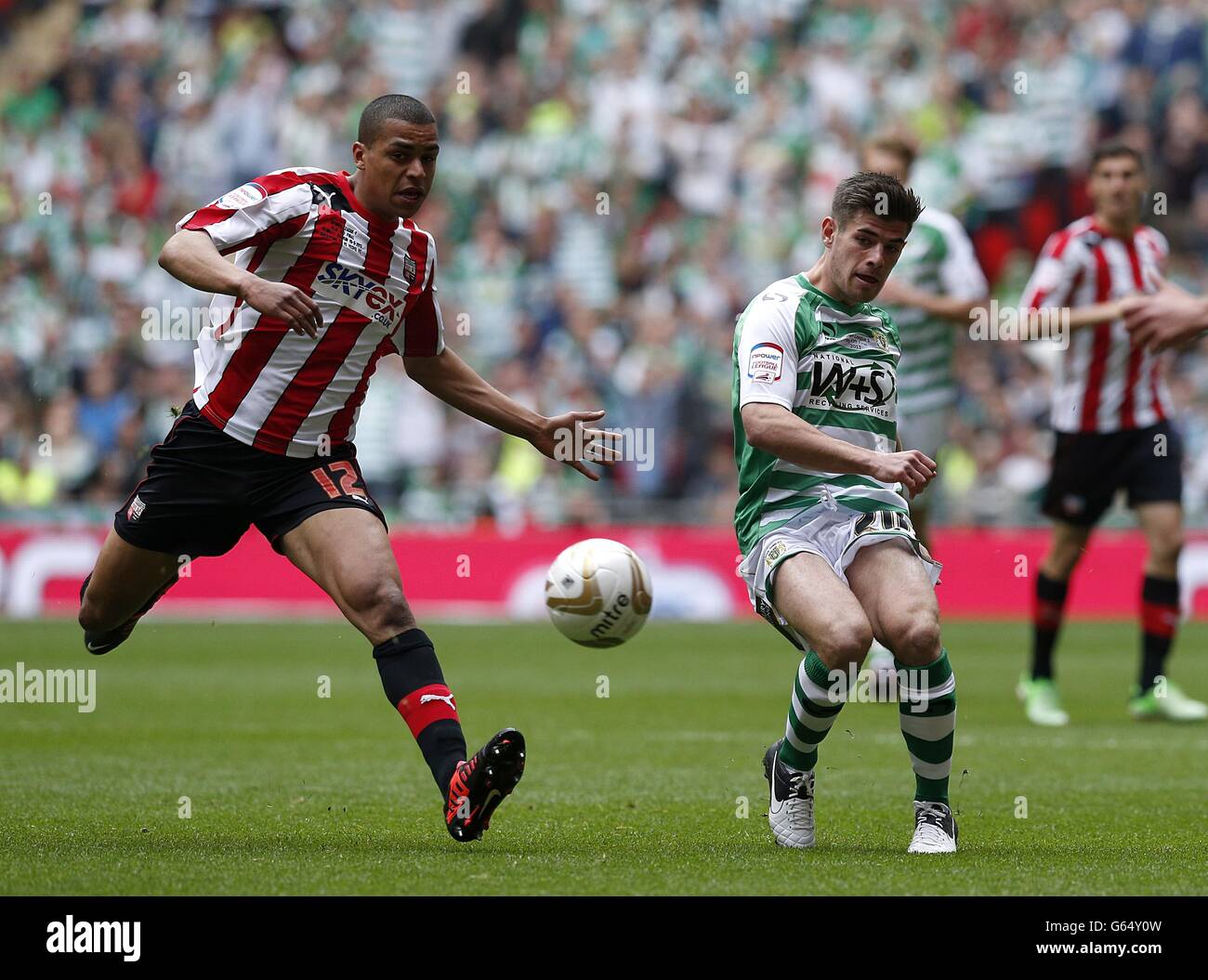 Yeovil Town's Joe Edwards (right) and Brentford's Tom Adeyemi (left ...