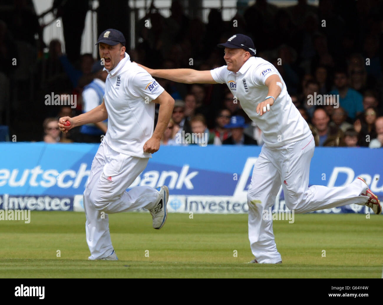 England's Jonathan Trott (left) is congratulated by Johnny Bairstow ...