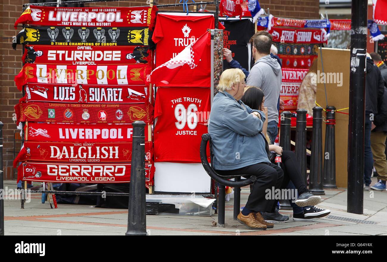 Fans and merchant sellers outside Anfield Stadium ahead of the Barclays ...