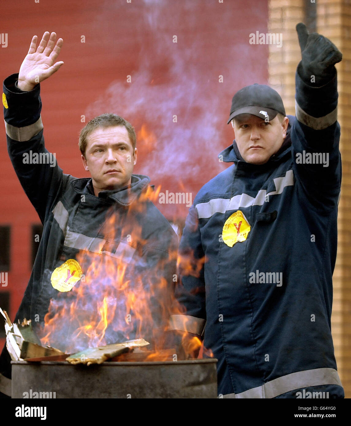 Firefighters from Glasgow's Maryhill fire station wave to motorists ...