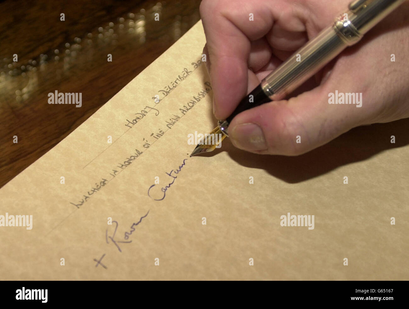 Rev Williams signs new signature Stock Photo - Alamy