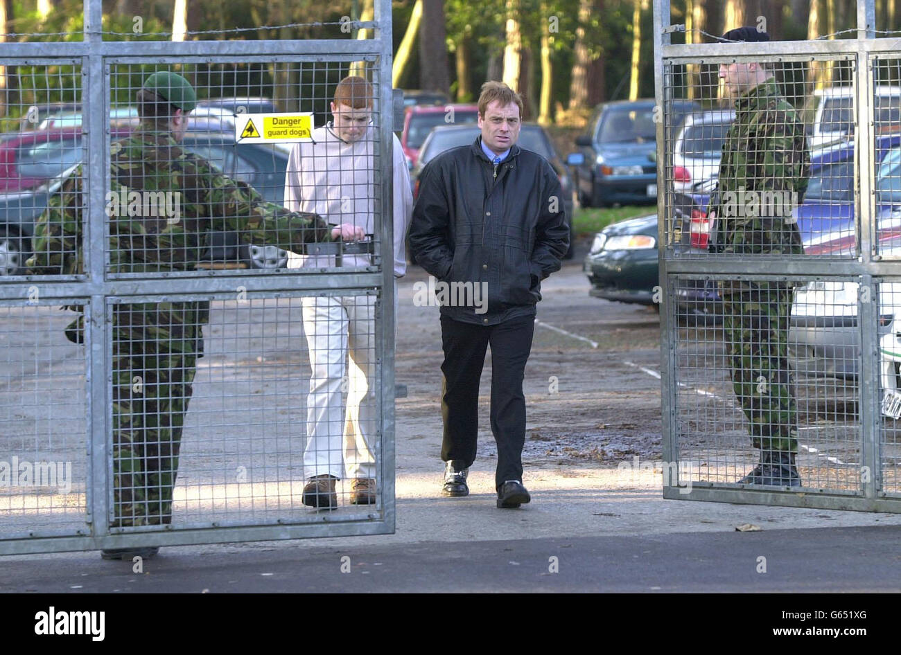 Jim Collinson, 40, and his son Stuart, 16 (centre left) leave Deepcut ...