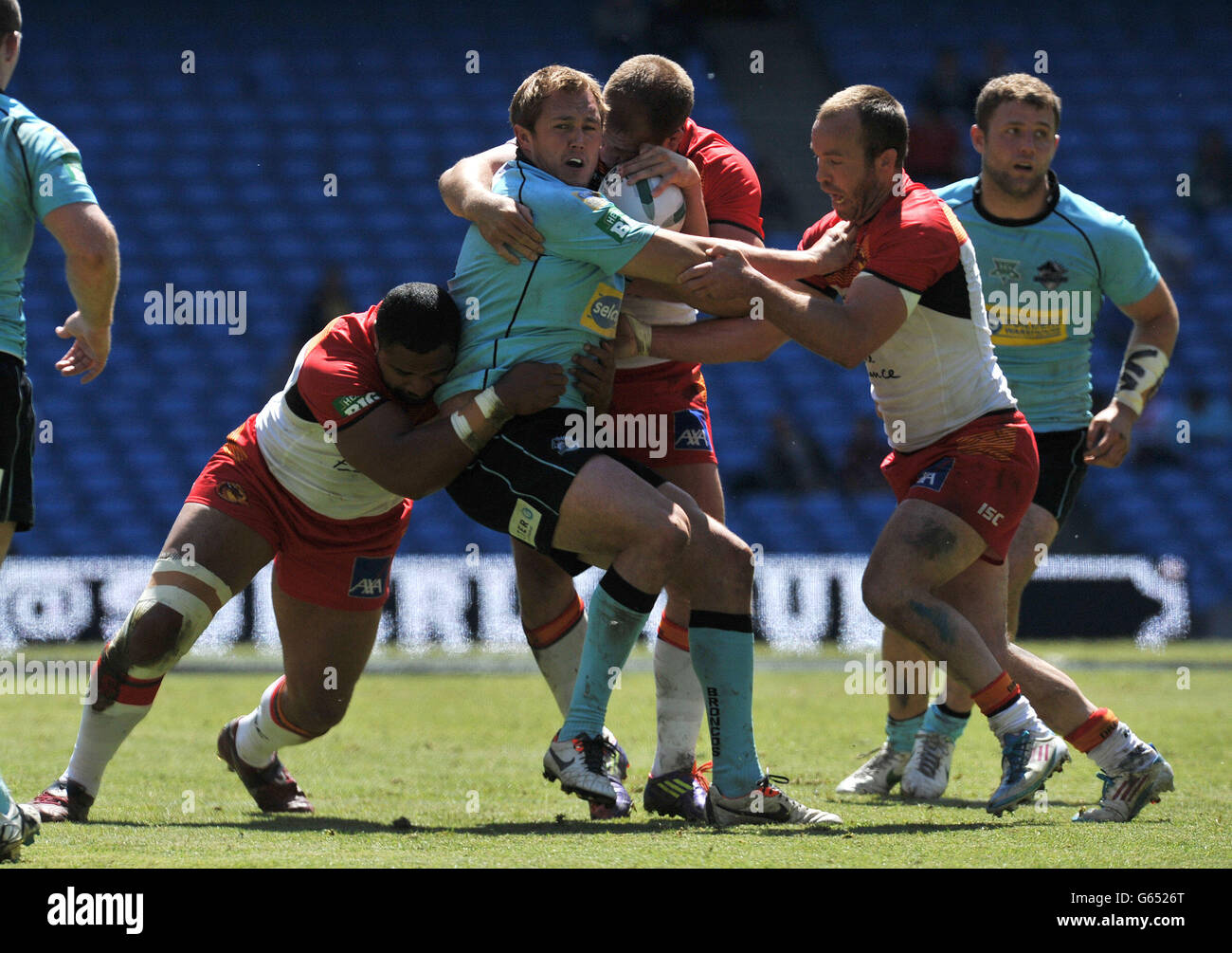 London Broncos' Scott Wheeldon is held by the Catalan Dragons' defence ...