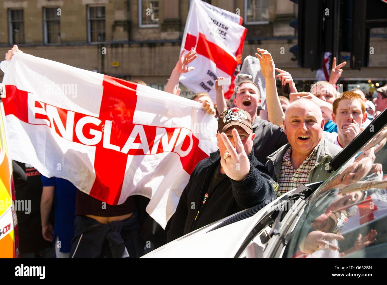 EDL march in Newcastle. NOTE HAND GESTURES People taking part in the ...