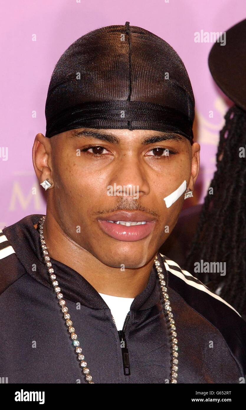 US R n B star Nelly poses for photographers during the Billboard Music ...