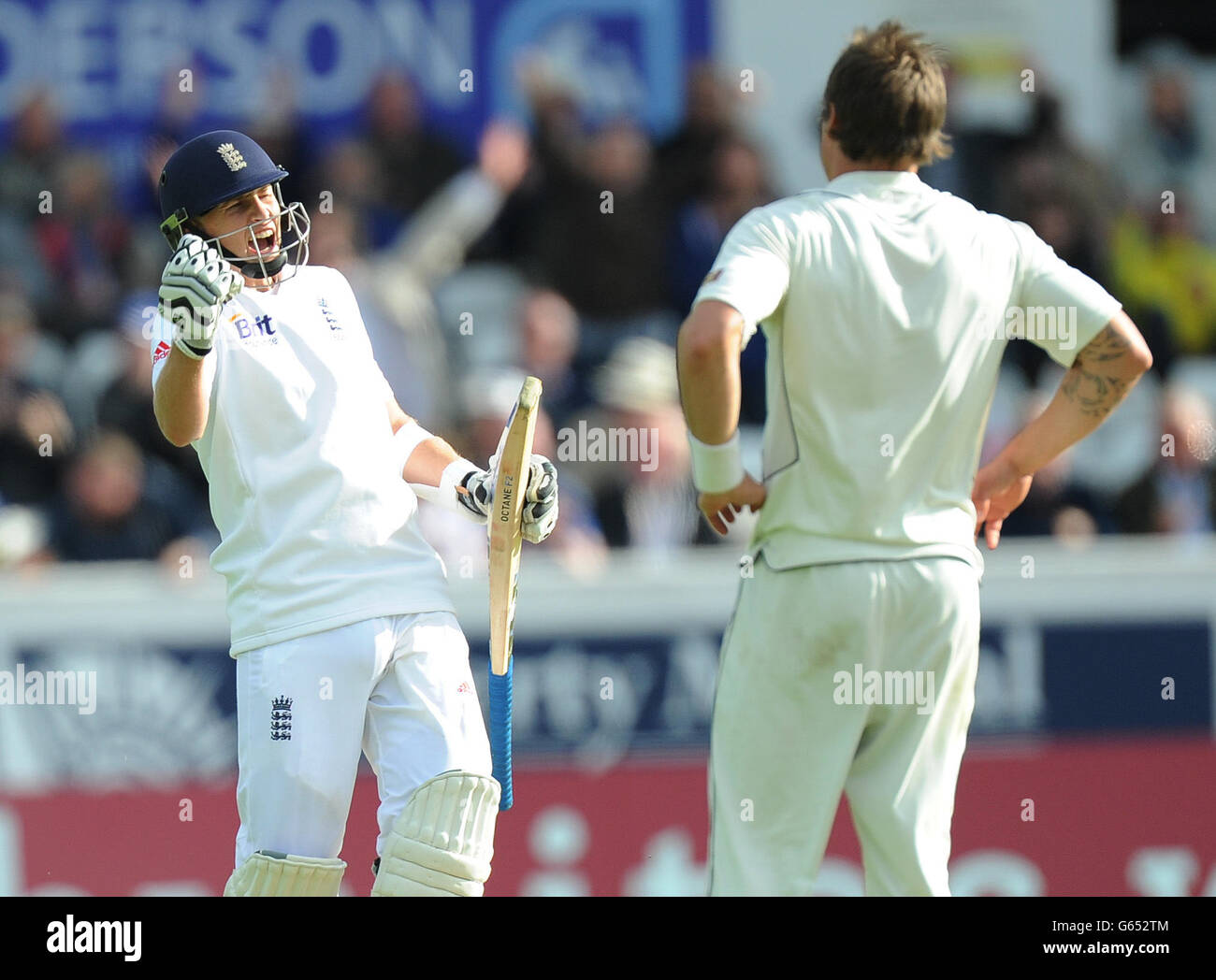 England's Joe Root (left) celebrates his 100 against New Zealand during ...