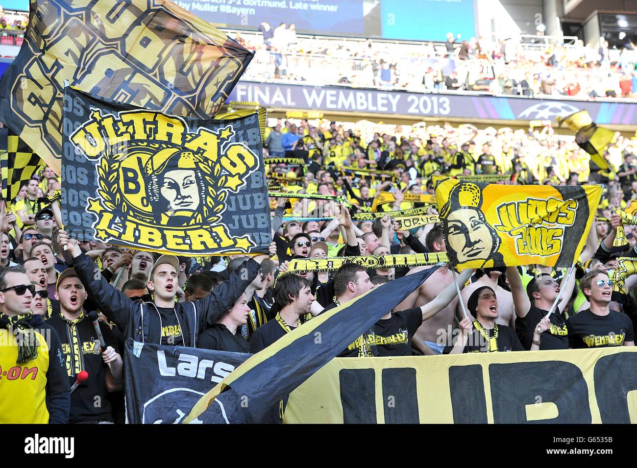 Borussia dortmund fans show their passion in the stands hi-res stock ...
