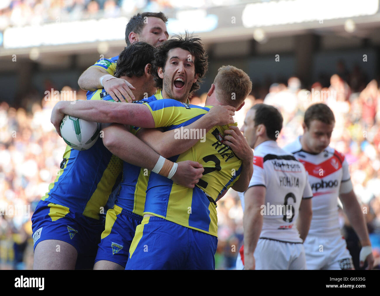 Warrington Wolves' Chris Riley celebrates with team-mates after scoring ...