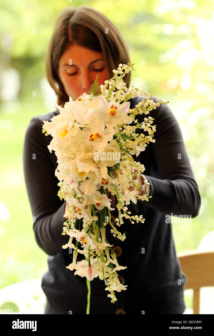 Lottie Longman of Longman's Florists, seen in Ilford, Essex, with a ...