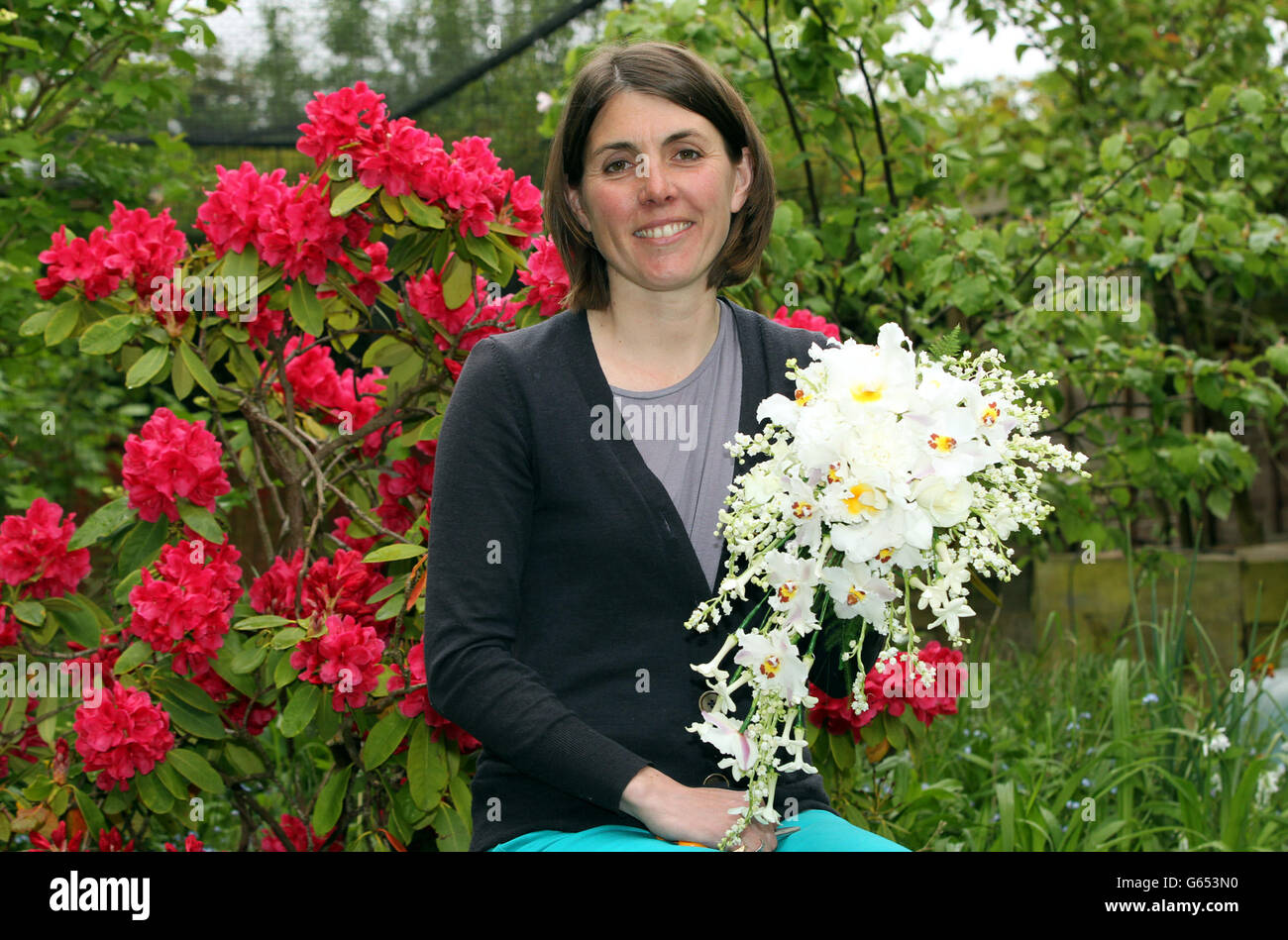 Lottie Longman of Longman's Florists, seen in Ilford, Essex, with a ...