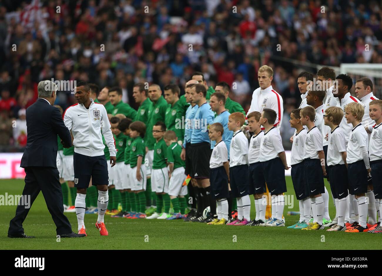 England's captain Ashley Cole shakes hands with the FA chairman David ...