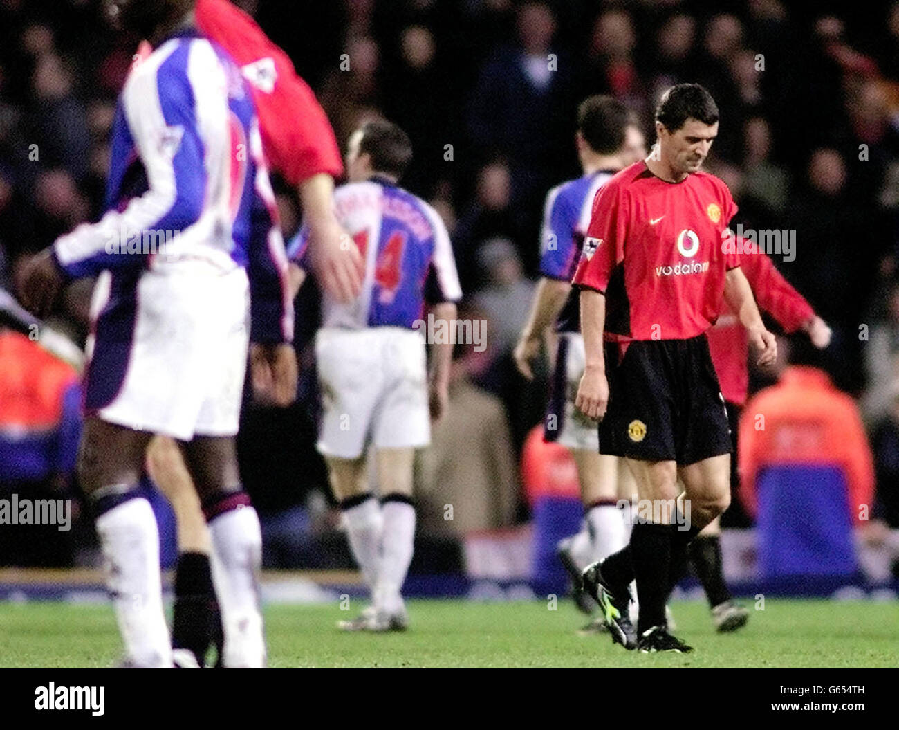 Manchester United captain Roy Keane leaves the field after his team ...