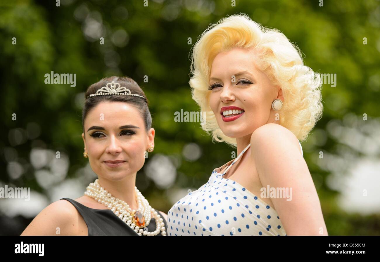 Racegoers Zoe Carter (left) and Julie Kennedy during the Investec Derby ...
