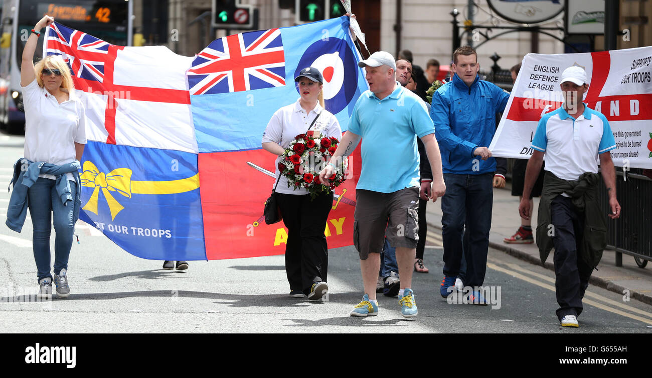 Drummer Lee Rigby murder. Members of the EDL lay a wreath during a ...
