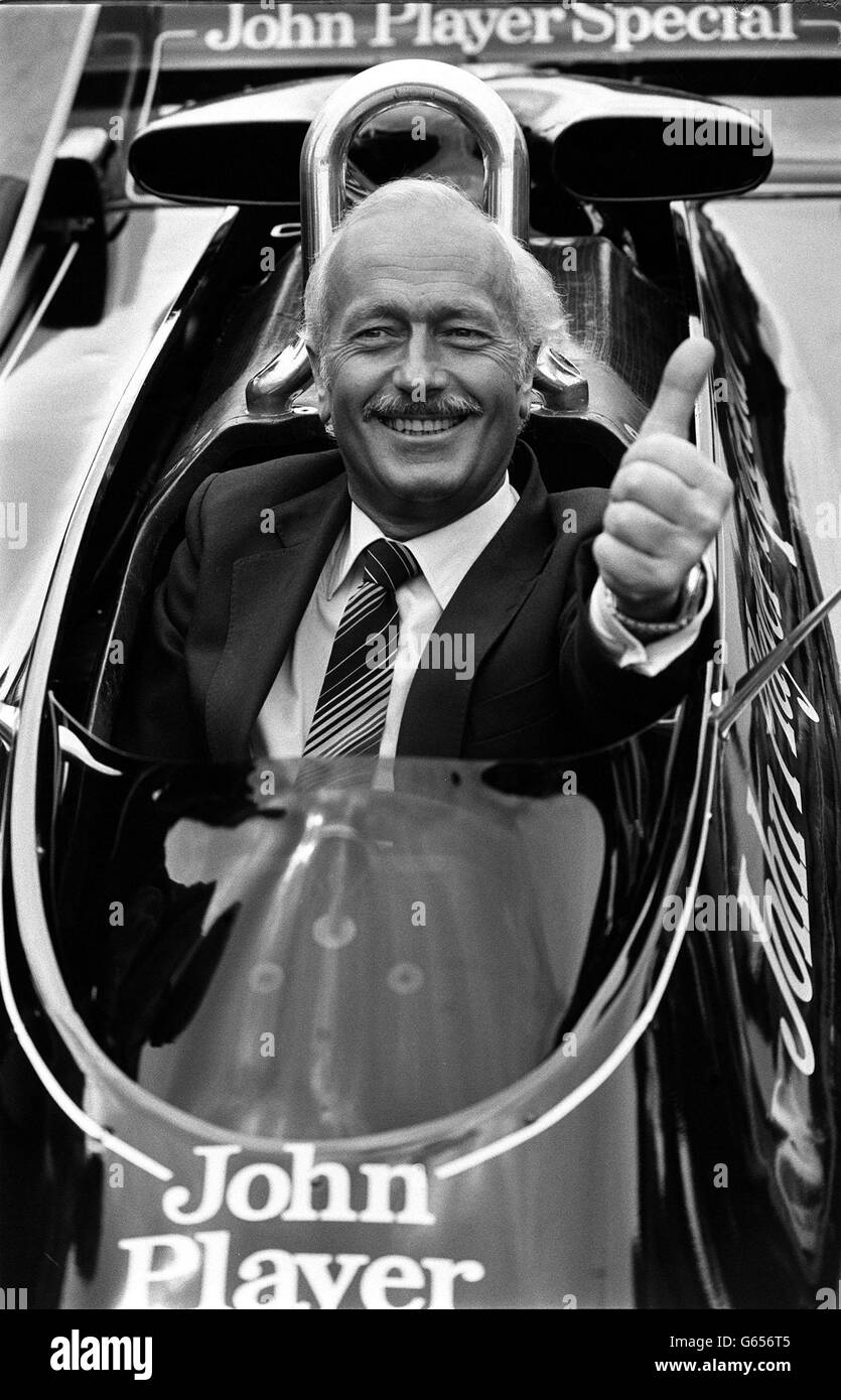 A delighted Colin Chapman, owner and design inspiration of Lotus sits ...