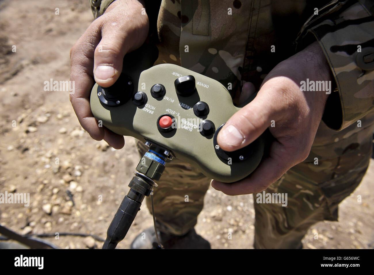 A soldier uses a games consol style controller to control a Terrier ...
