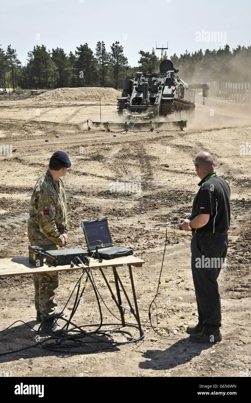 An engineer uses a games consol style controller to control a Terrier ...