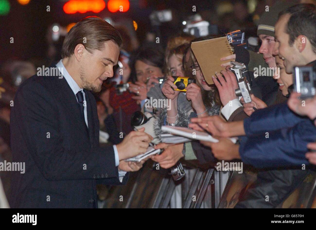 Actor Leonardo DiCaprio signs autographs as he arrives at The Empire ...