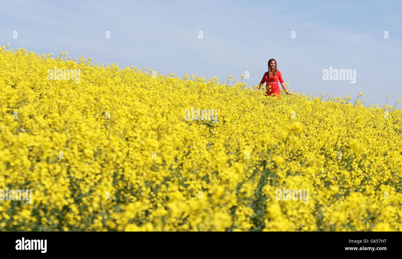 Magda Tatar walks through a field of oilseed rape on the farm of Edward ...