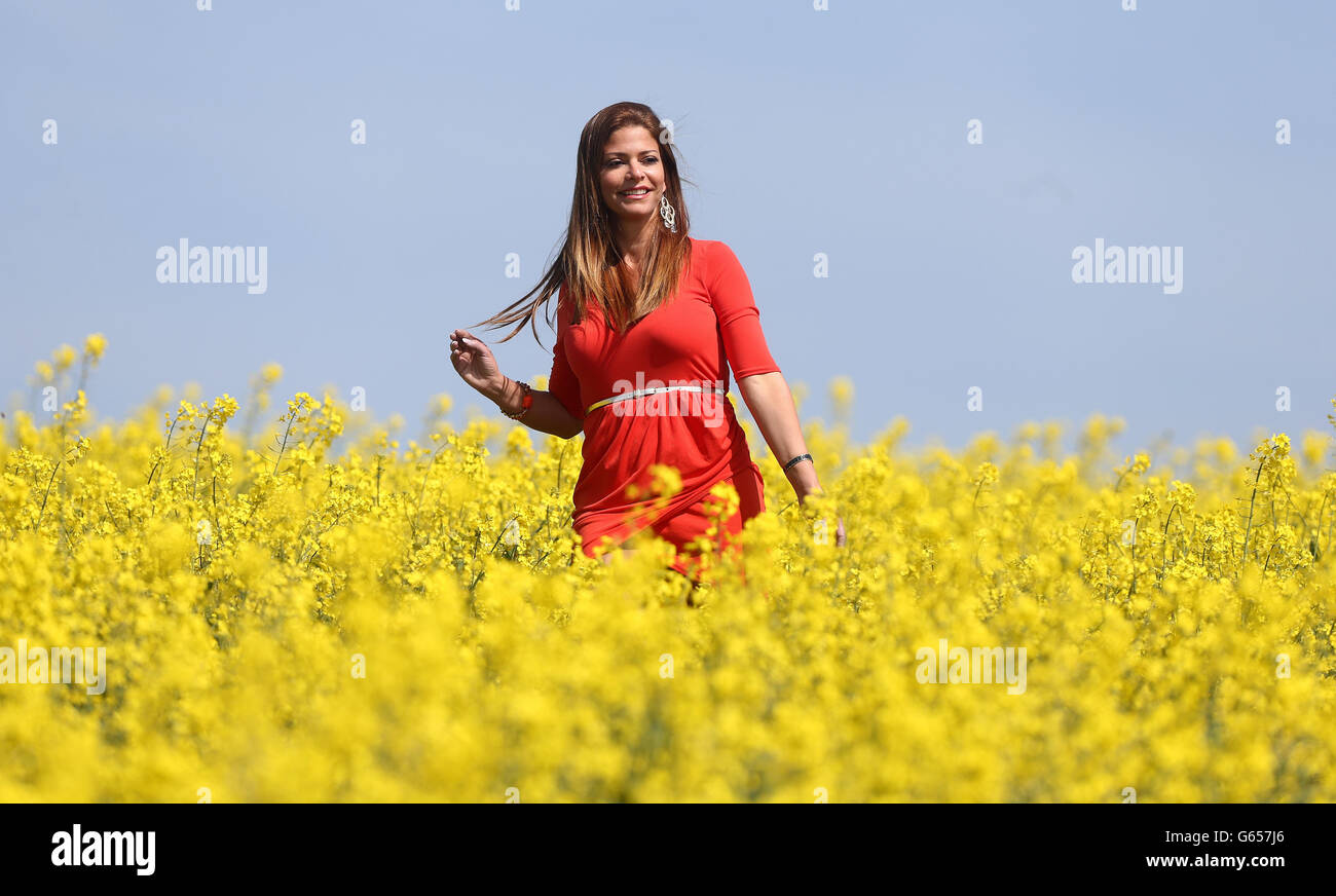 Magda Tatar walks through a field of oilseed rape on the farm of Edward ...