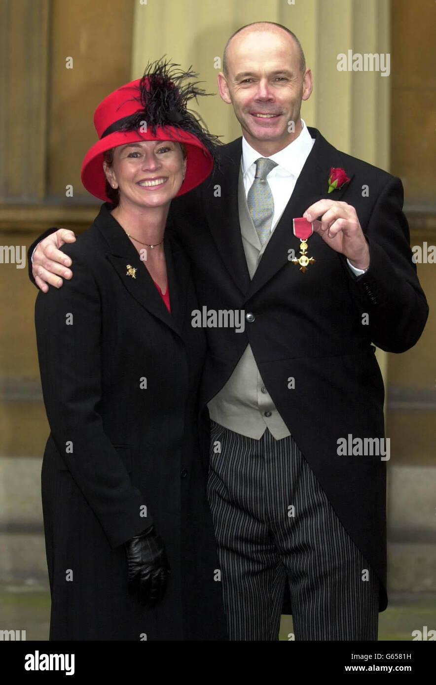England Rugby Union manager Clive Woodward, with his wife Jayne, holds ...