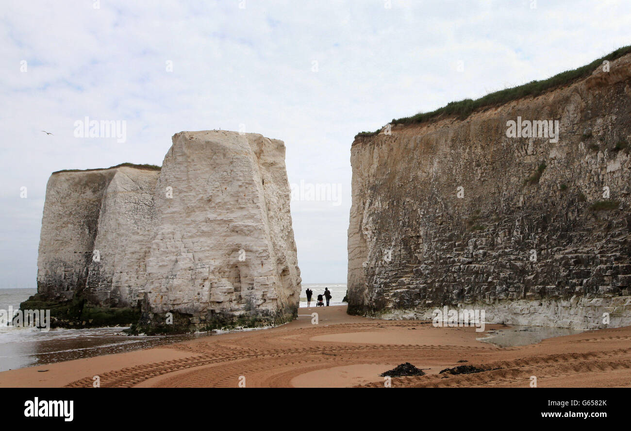 A family walk along Botany Bay beach , one of eight beaches in the area ...