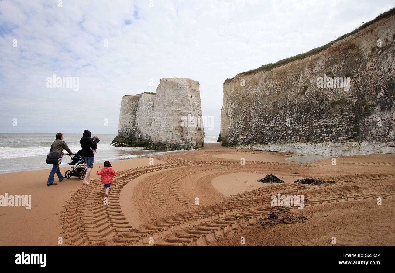 A family walk along Botany Bay beach , one of eight beaches in the area ...