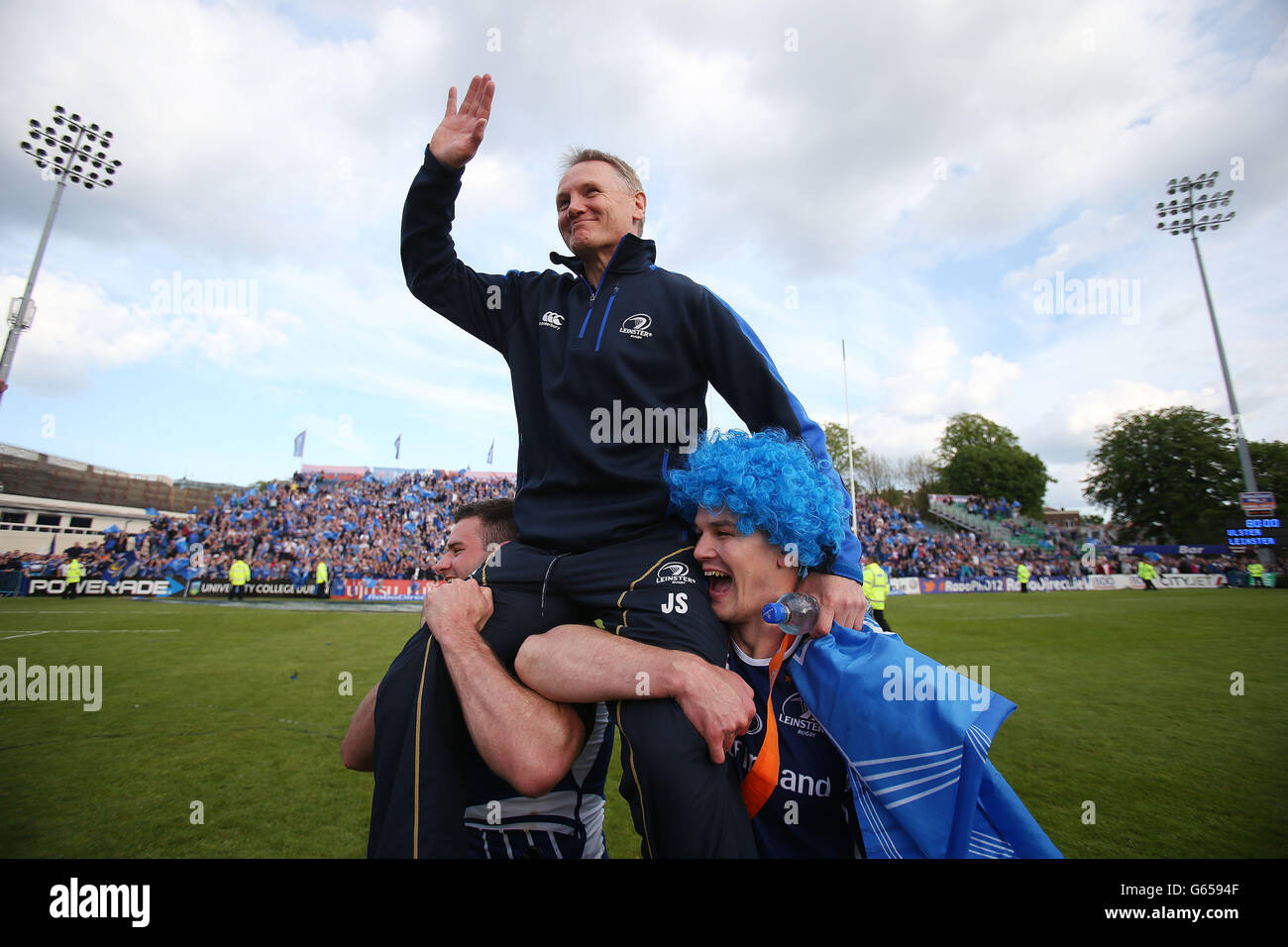 Leinster's Jonny Sexton and Fergus McFadden carry their coach Joe ...