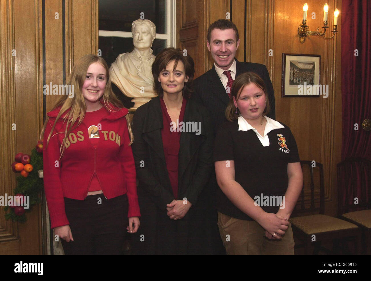 Cherie Blair stands for a portrait with Adam Price MP (back) and (from ...