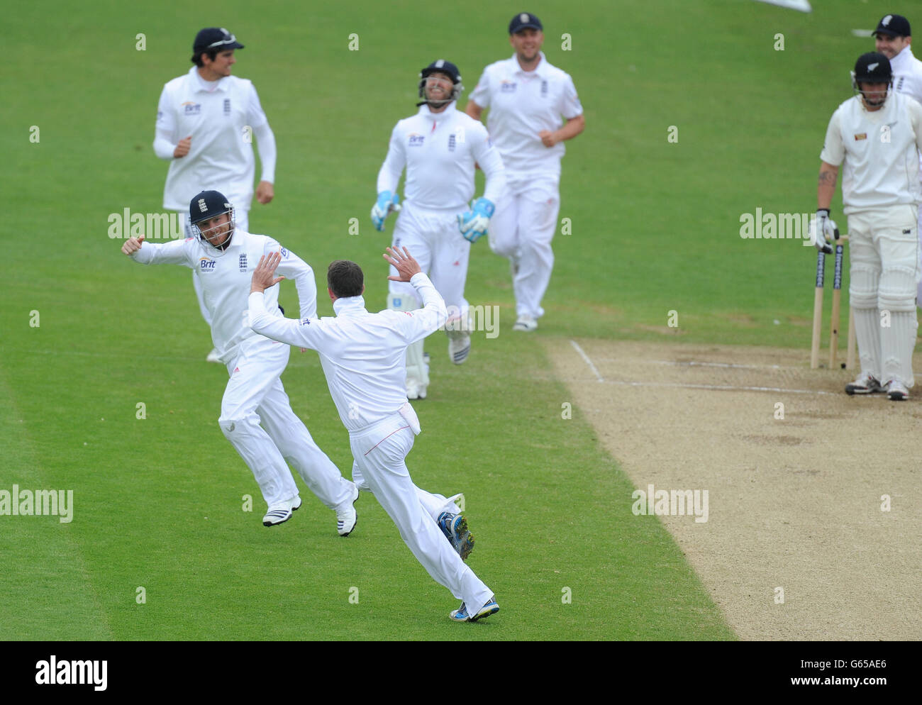 England's Graeme Swann (bottom) and Ian Bell (left) who caught out New ...