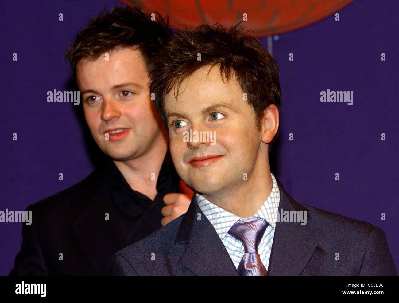 TV presenter Declan Donnelly poses with his waxwork model during a ...