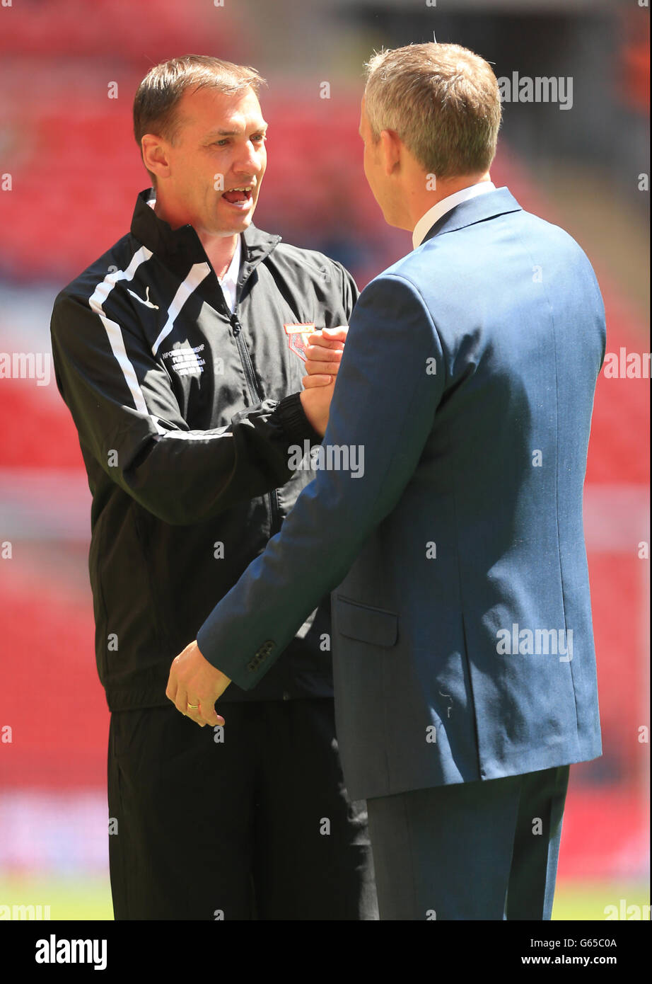Watford goalkeeping coach Alec Chamberlain (left) greets Crystal Palace assistant manager Keith ...