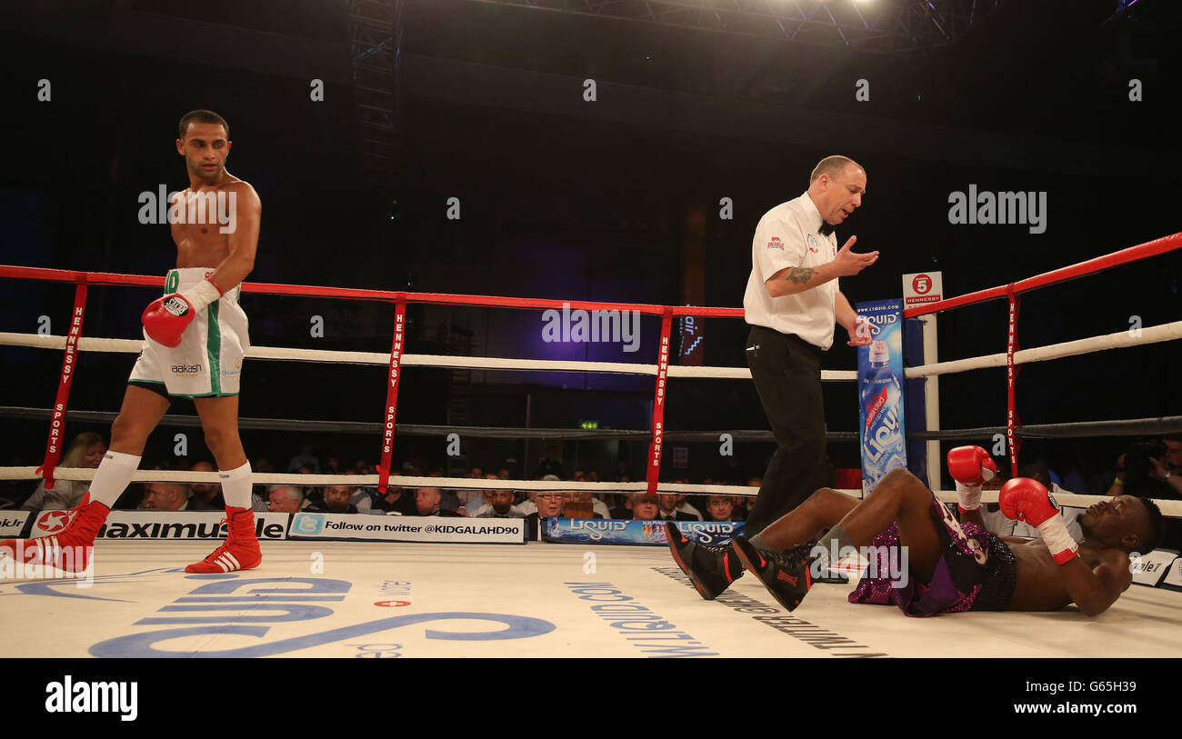 Boxing - Glow at Bluewater. Kid Galahad knock down Isaac Nettey during the featherweight bout at ...