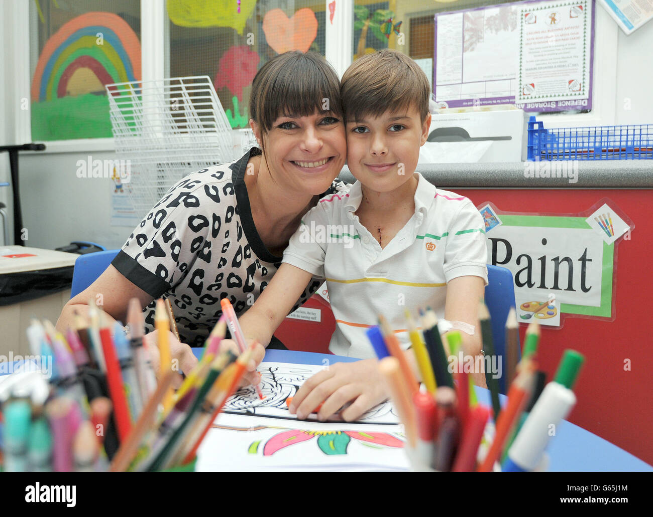 Lisa Grayson sits with her son Ollie Grayson, aged 11, from Sheffield ...