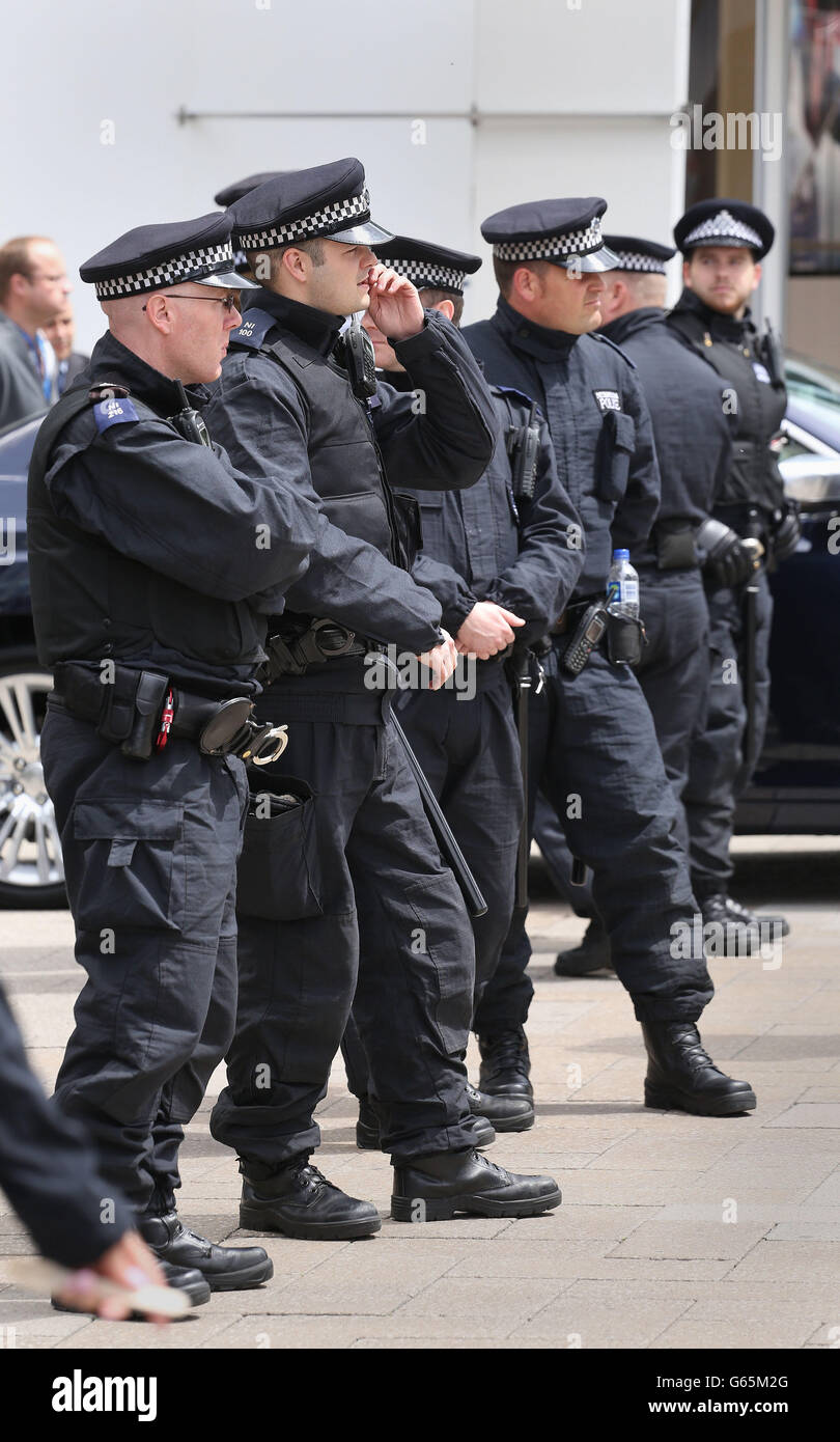 Police watching protesters demonstrating against the G8 summit at ...