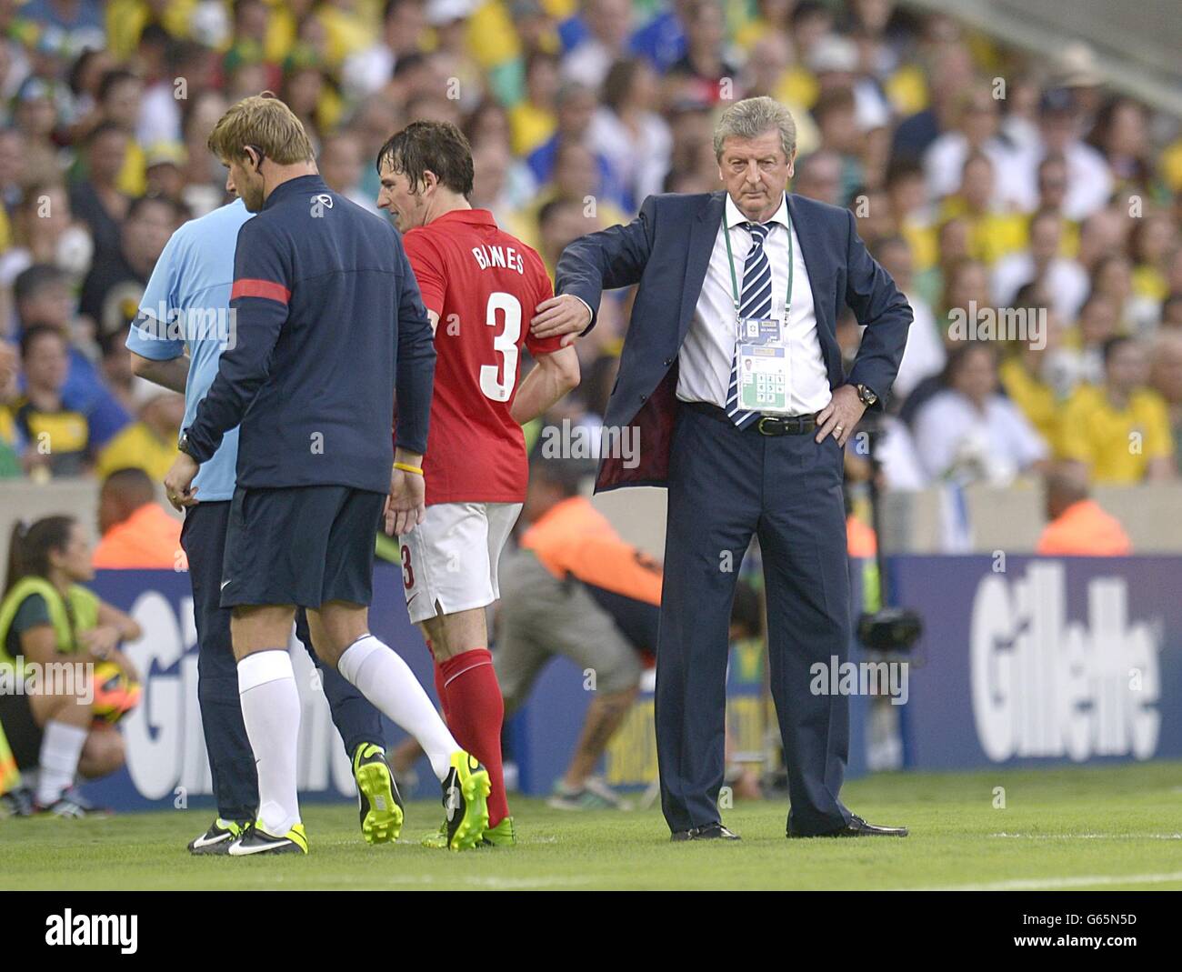 England's Leighton Baines receives a pat on the back from manager Roy ...