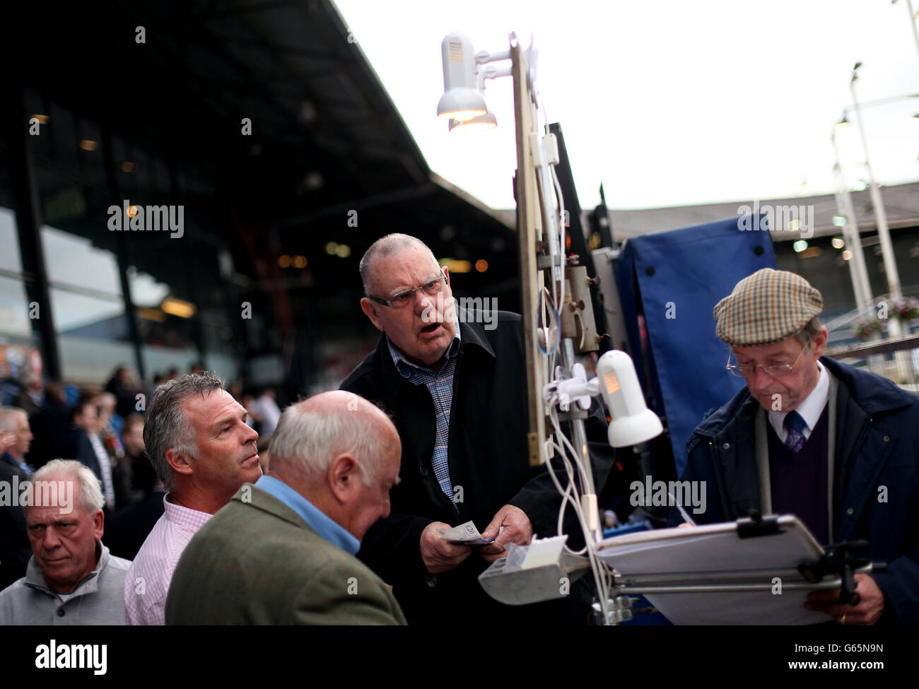 Bookmakers at work inside WImbledon Greyhound Stadium Stock Photo - Alamy