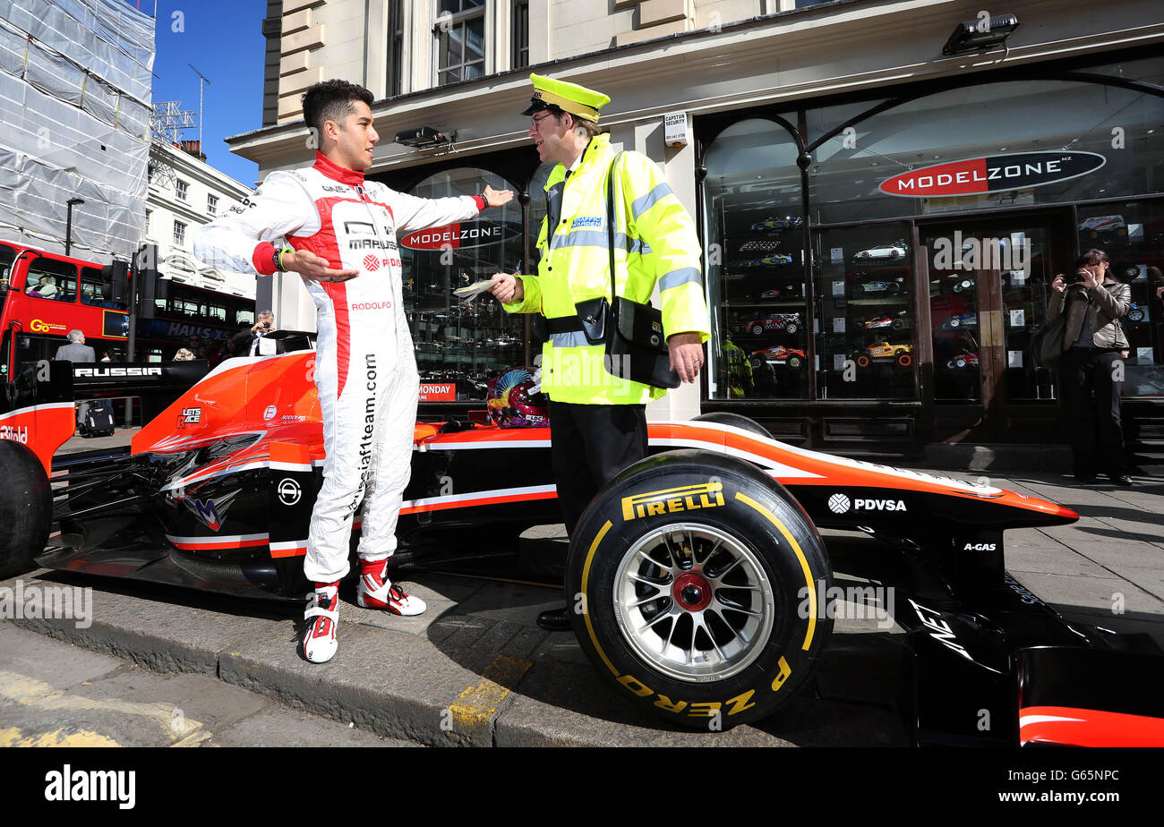 s New Oxford Street, as an actor dressed as a traffic warden clamps his ...